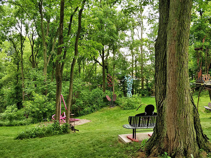 The garden's unique sculptures nestle among the trees like they've always belonged there, nature and human creativity shaking hands and becoming friends.