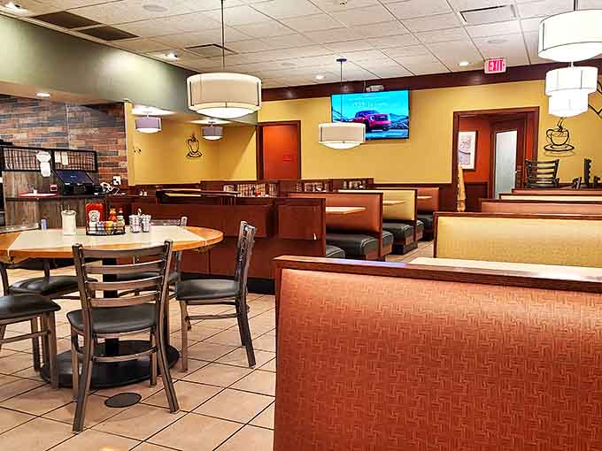 Comfortable booths and thoughtful lighting create an atmosphere where lingering over coffee and conversation comes naturally.