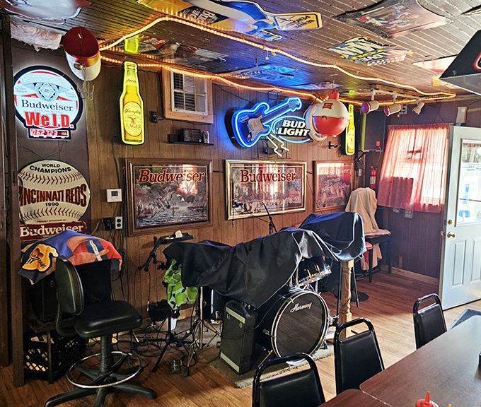 Beer signs and fishing memorabilia create an atmosphere that corporate chains spend millions trying to replicate.