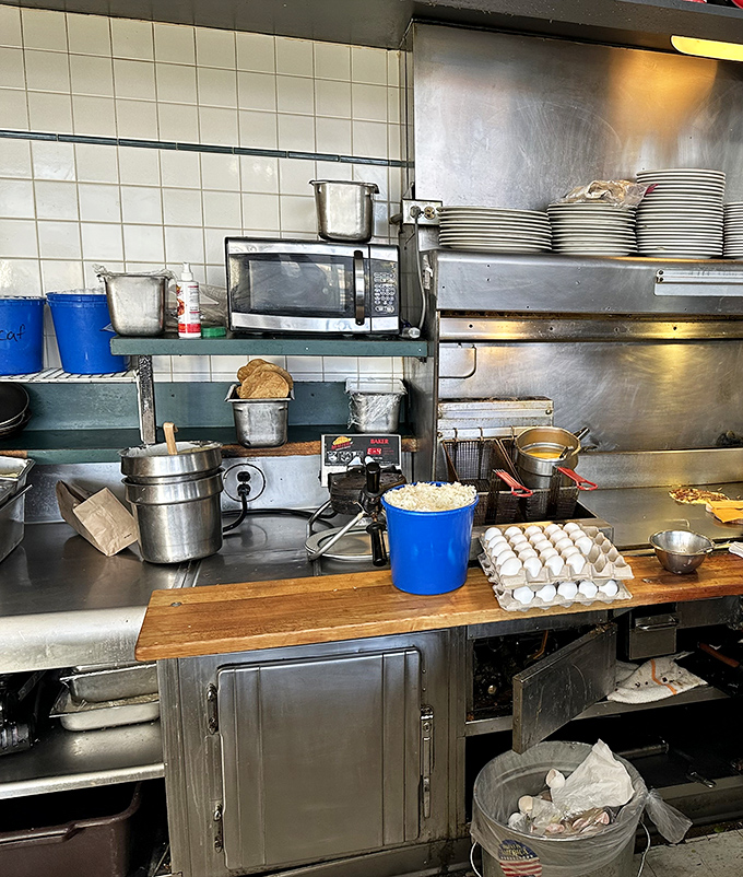 Behind the scenes magic &ndash; the organized chaos of a busy diner kitchen where breakfast dreams are constructed one pancake at a time.