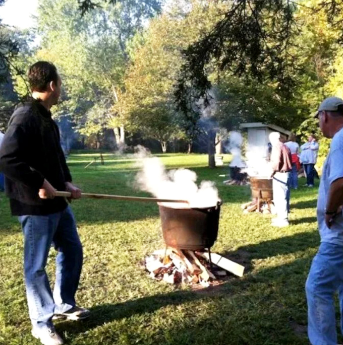 Stirring apple butter requires patience and muscle &ndash; these copper kettles have seasoned countless batches while stories are exchanged around the fire.