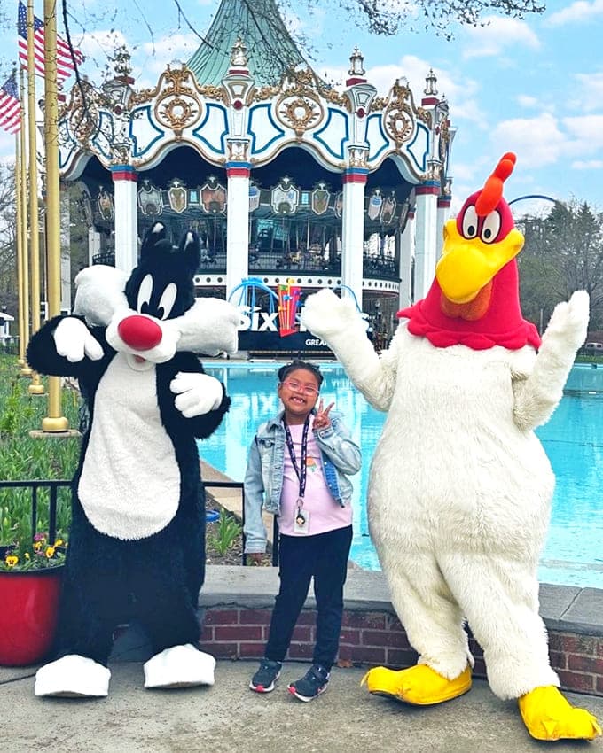 Meeting the park mascots after riding Sky Striker, when you're still not entirely sure which way is up.