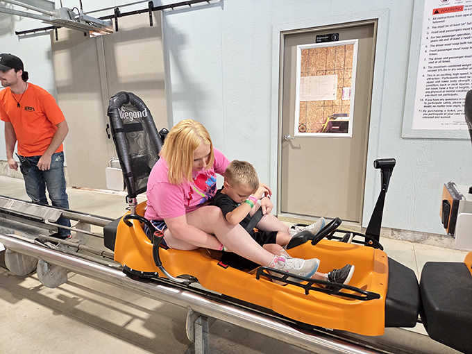 Creating core memories one ride at a time. Mom and son share a moment that'll outlast any souvenir from the gift shop.