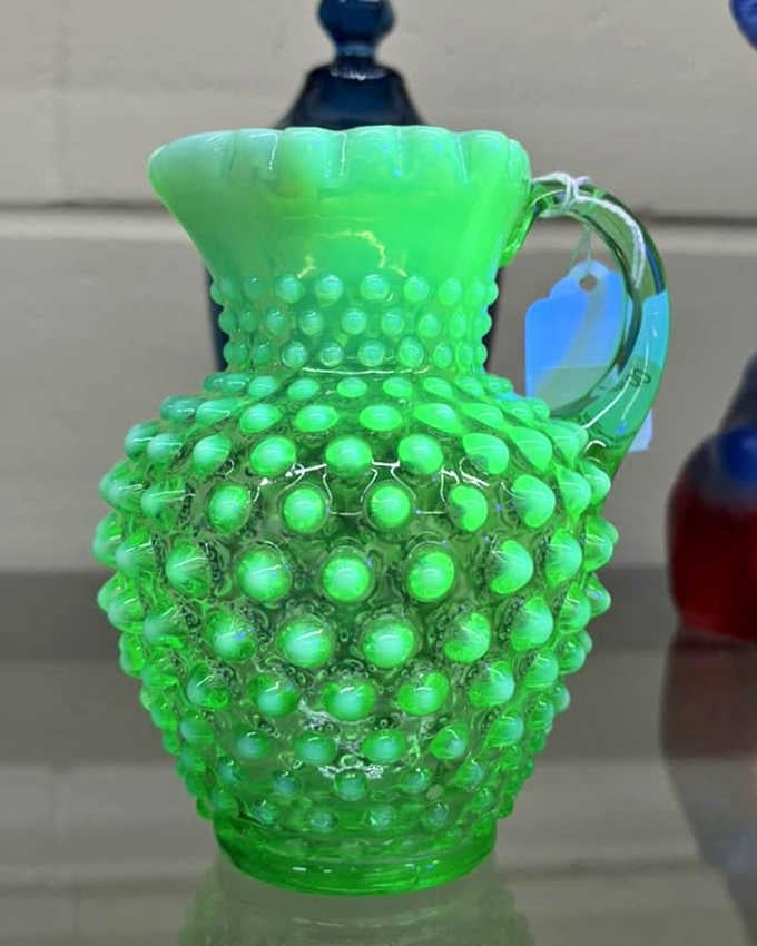 This neon green hobnail pitcher practically glows with vintage charm, ready to brighten up your table and your Instagram feed simultaneously.