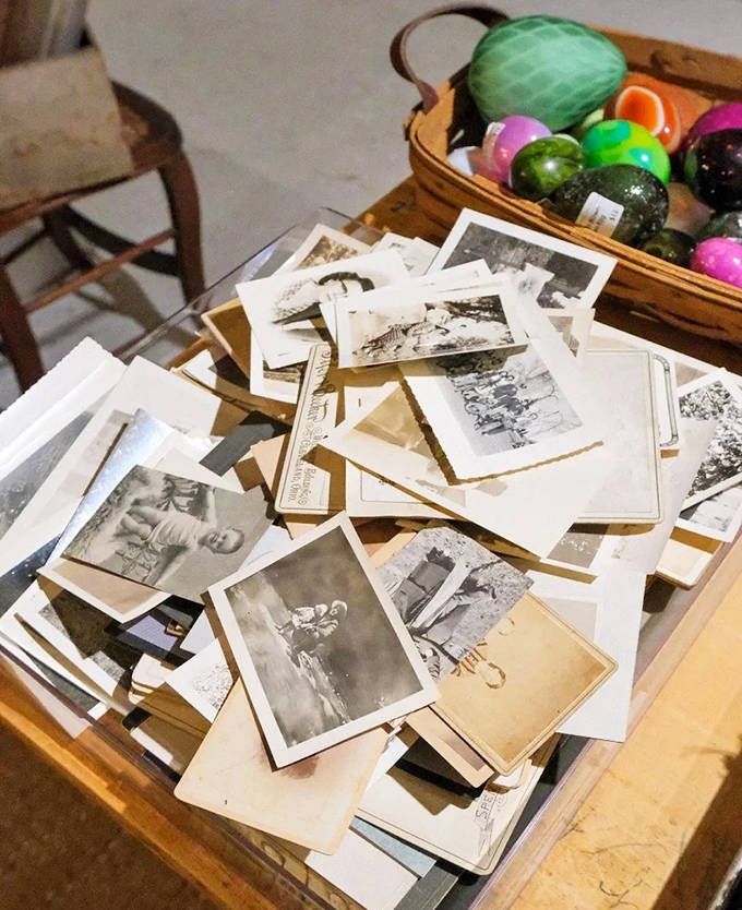 A table of vintage photographs offers glimpses into strangers' lives &ndash; each image a tiny time machine to moments long past.