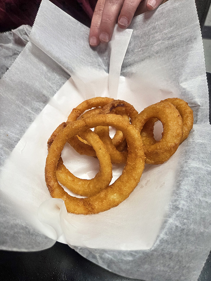 Golden, crispy onion rings that shatter satisfyingly with each bite&mdash;proof that vegetables can be transformed into something transcendent.