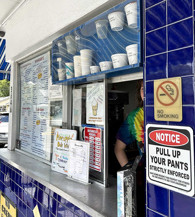 The order counter where magic happens &ndash; complete with the famous "Pull Up Your Pants" sign that adds a touch of old-school charm.