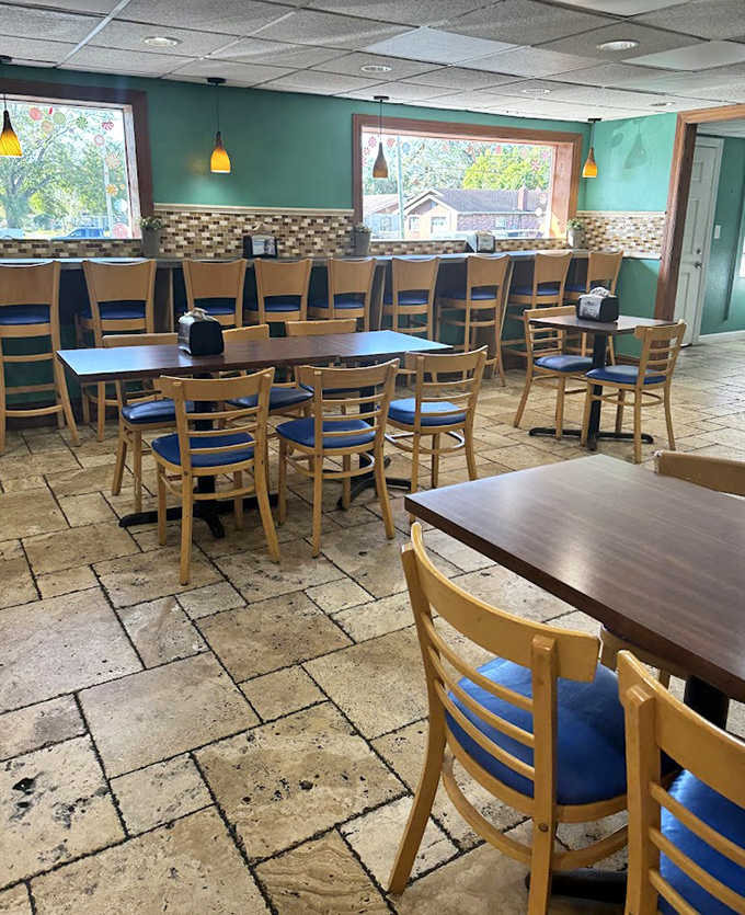 Chrome-edged tables, vintage red chairs, and walls adorned with classic car memorabilia create the perfect stage for making memories over milkshakes and burgers.