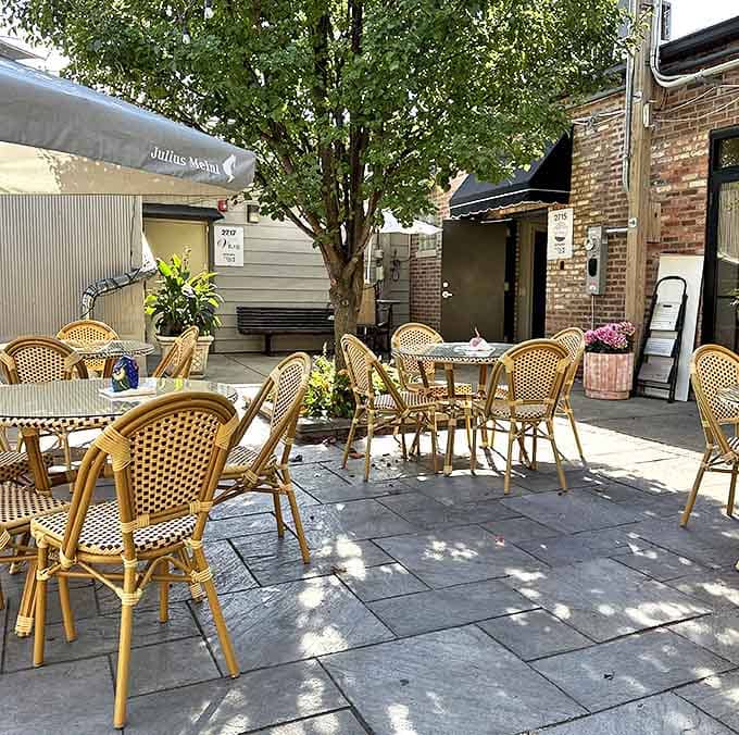 The outdoor patio offers Parisian vibes with bistro seating surrounded by greenery&mdash;perfect for people-watching with your pastry.