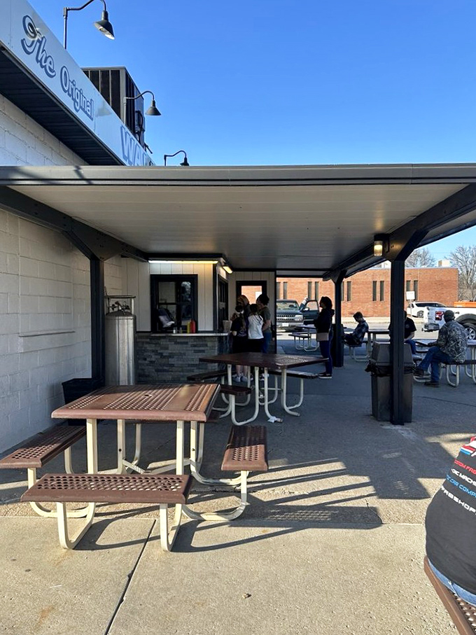 These picnic tables have witnessed first dates, family celebrations, and countless "mmm" moments under the shade of simple umbrellas.