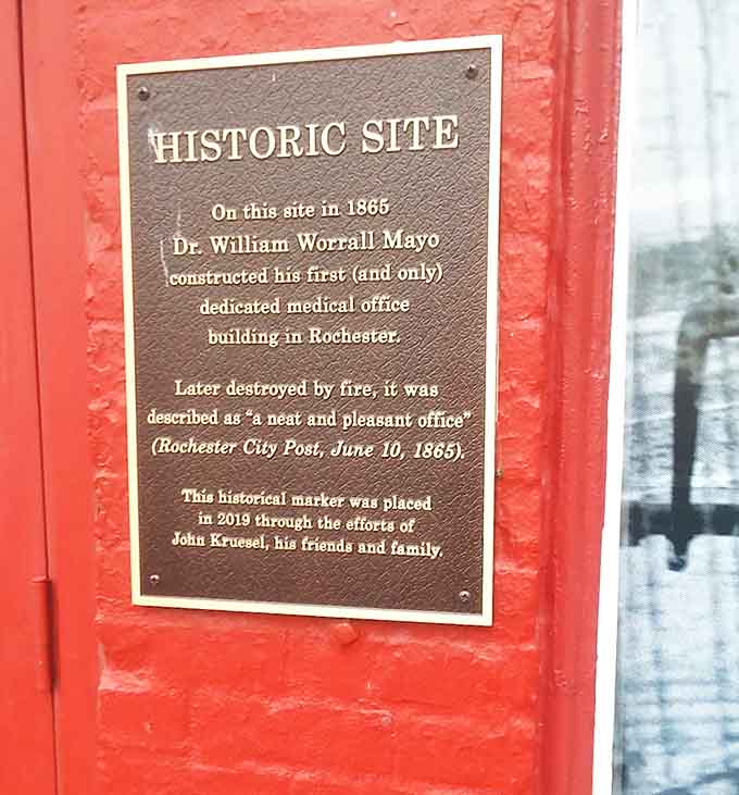 A historic plaque reveals this site's connection to Dr. Mayo's first medical office in 1865, adding another layer of significance to this history-filled space.