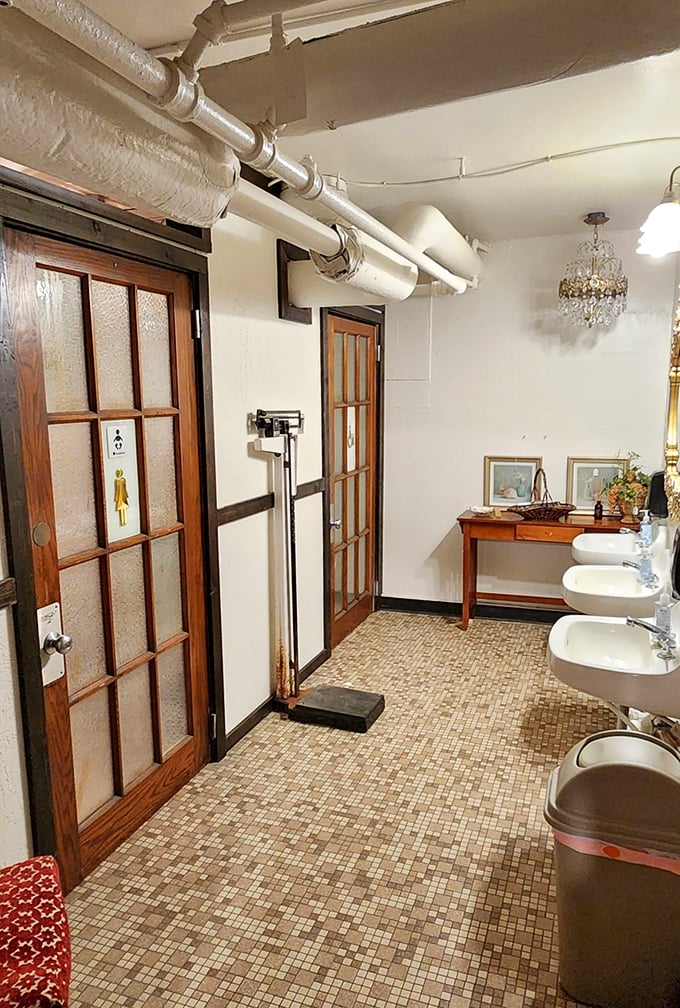The vintage bathroom fixtures maintain their original charm &ndash; those sinks have probably heard more gossip than a small-town barber shop.
