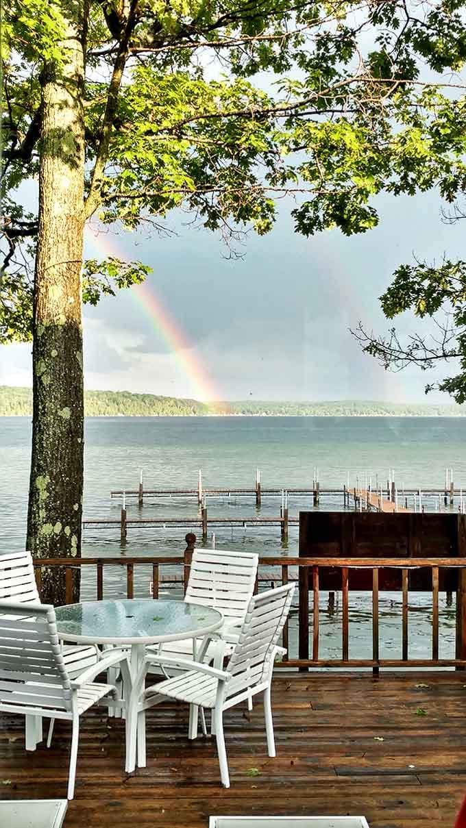 Double blessing: A rainbow arches over Hubbard Lake's tranquil waters, nature's way of showing off when regular beauty isn't quite enough.