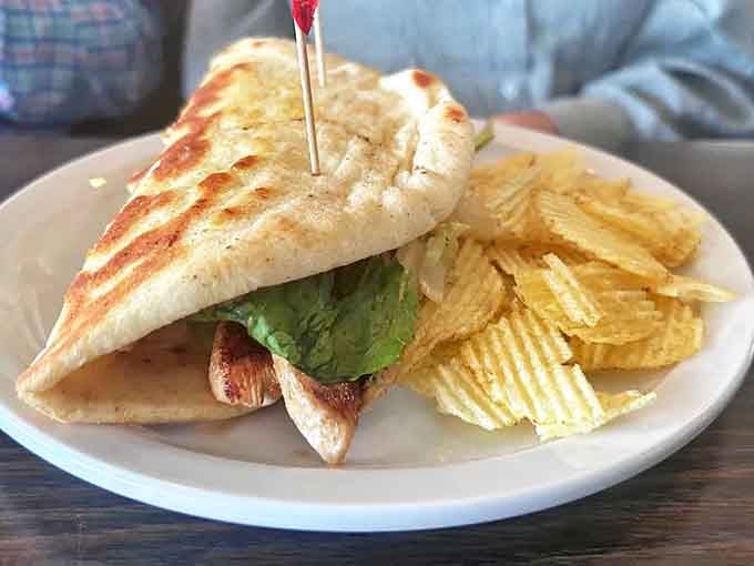 A perfectly grilled sandwich that requires both hands and possibly a strategy session before the first bite. Structural engineering meets lunchtime satisfaction.