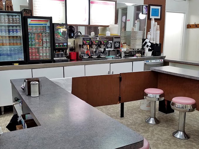 Seating Area: Pink stools invite patrons to stay awhile in this no-nonsense space designed for the increasingly rare activity of actual face-to-face conversation.