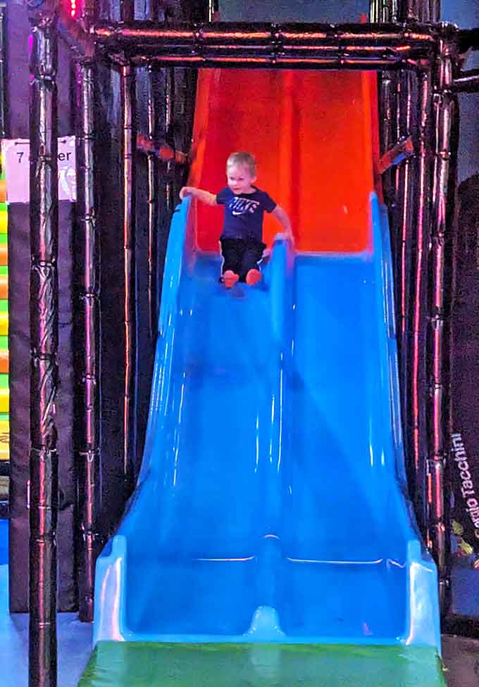 This slide delivers equal parts thrill and relief, offering a moment of joyful surrender as gravity finally gets its way after being defied elsewhere.