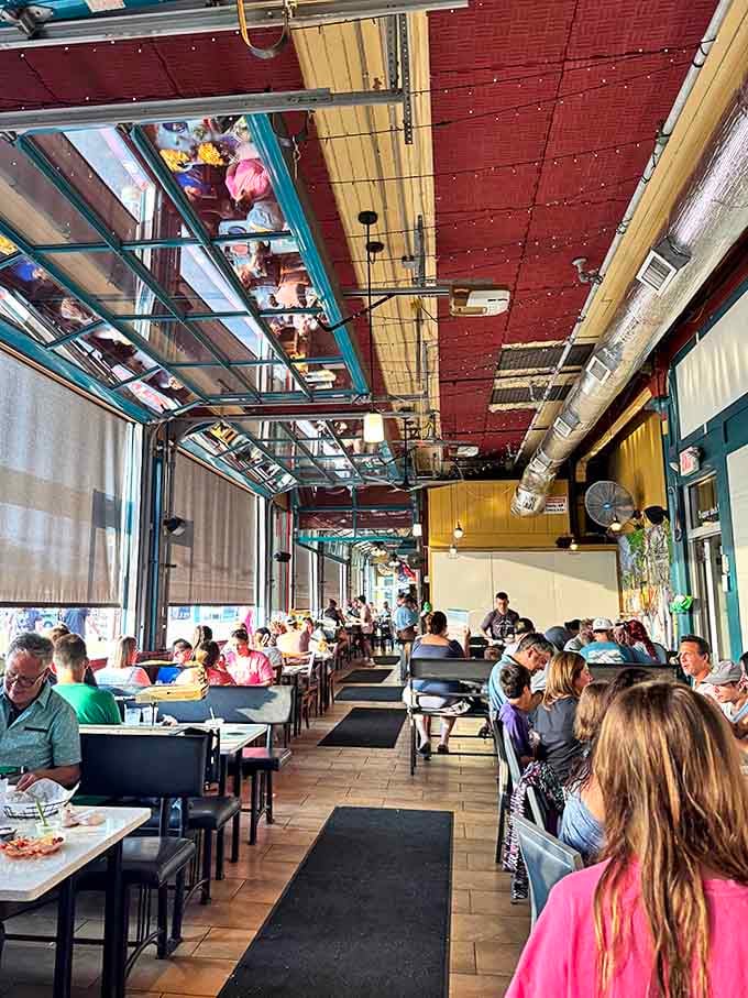 The spacious interior maintains the original waiting room's open feeling, with garage-style doors that welcome Lake Michigan breezes during warmer months.