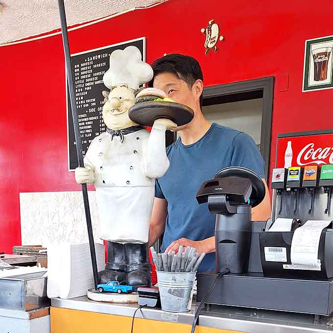 The chef statue stands guard over the counter, a whimsical sentinel protecting Roy's time-honored burger traditions.