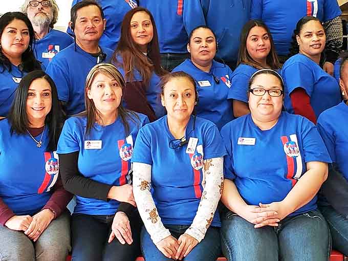 The dedicated staff in matching blue uniforms &ndash; laundry superheroes ready to rescue you from stain disasters.