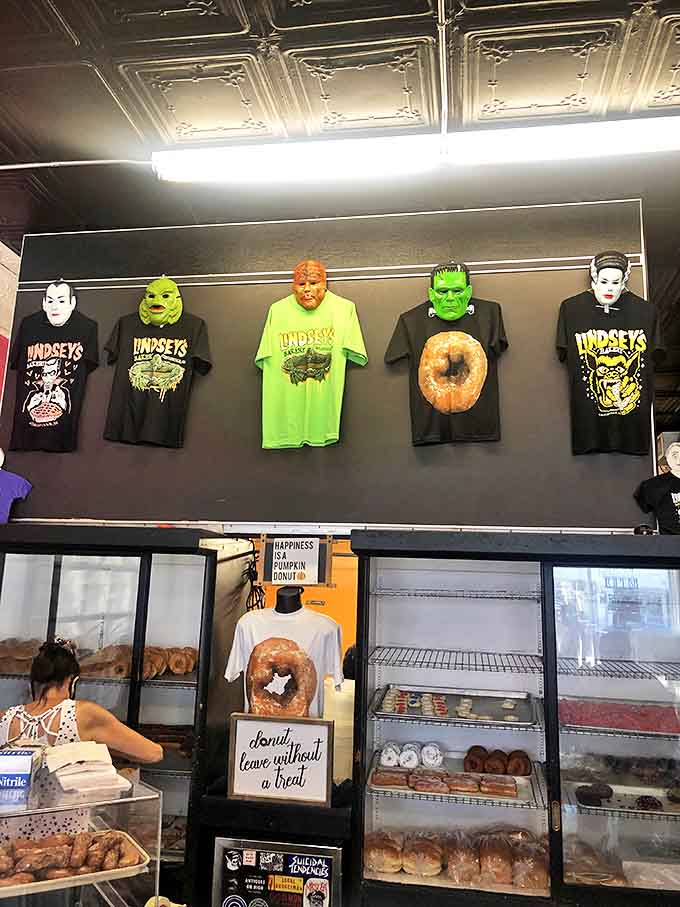 Monster-themed t-shirts hang above the donut display, proving that Lindsey's isn't just a bakery&mdash;it's a cultural institution.