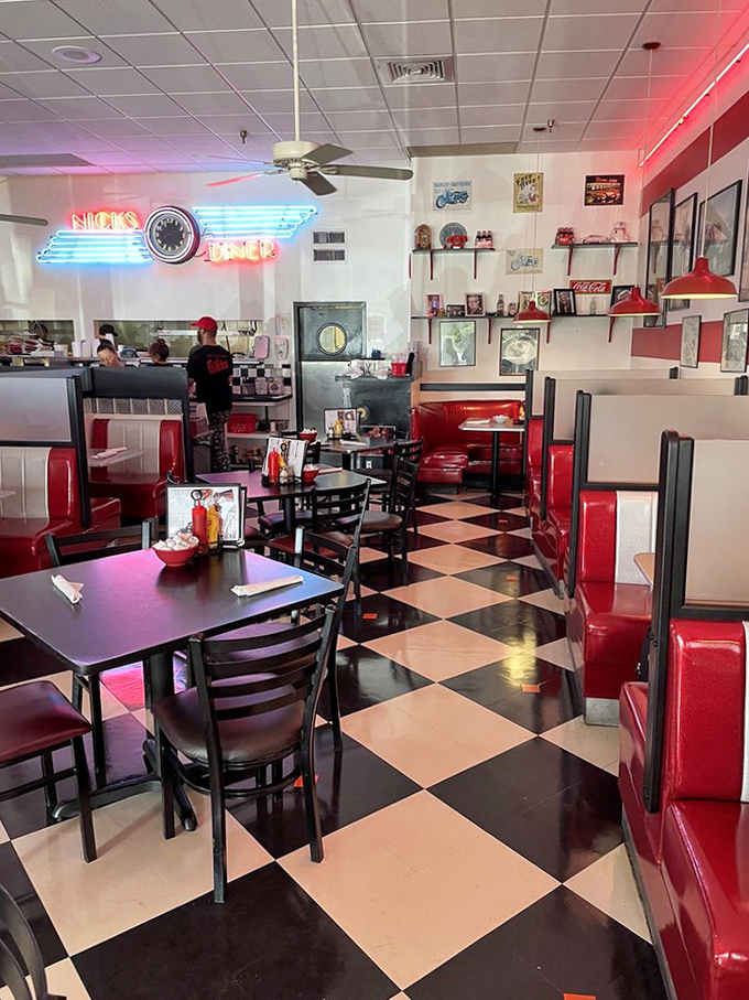 Red booths beckon with promises of comfort and calories, while the checkered floor reminds you that some classics never go out of style.
