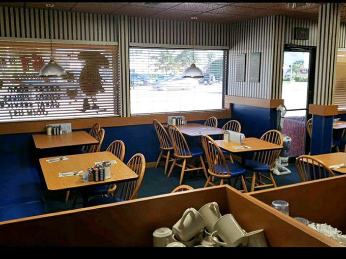 Comfortable wooden tables and chairs invite diners to settle in for a leisurely meal in an atmosphere of unpretentious charm.