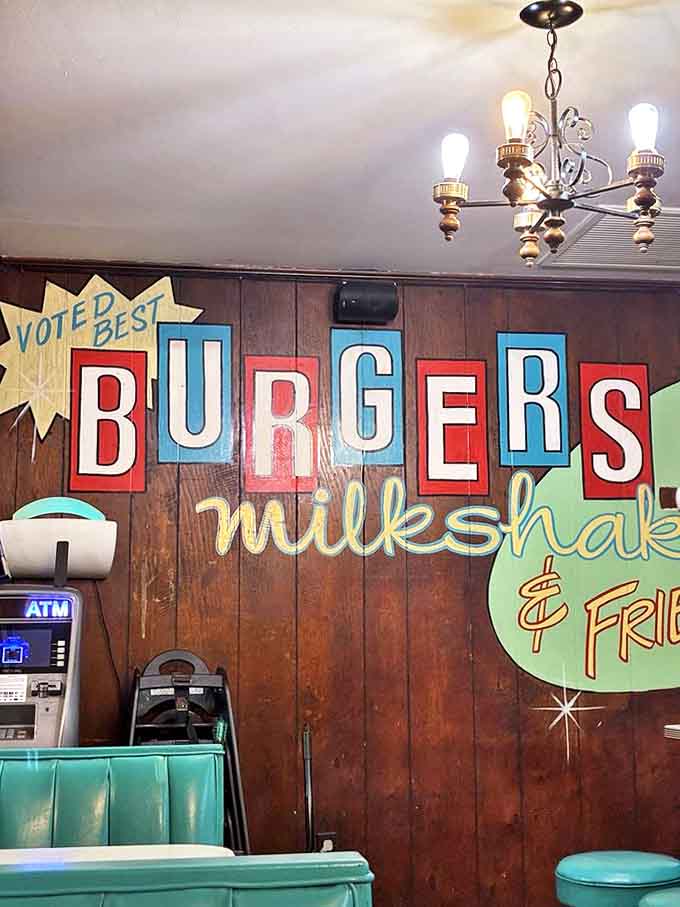 "Voted Best BURGERS" proclaims the hand-painted wall art, part of the visual history that tells the story of decades serving the community.