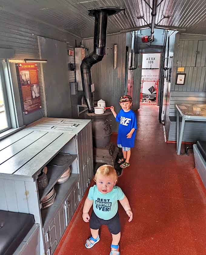 Future engineers explore the cramped quarters of a vintage caboose, discovering how train crews lived and worked in these rolling offices.
