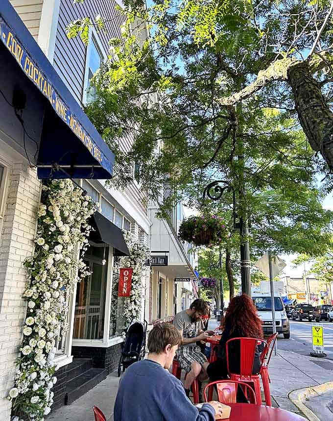 The outdoor seating area offers prime people-watching with your pastry &ndash; red chairs popping against white brick like a Parisian sidewalk caf&eacute;.