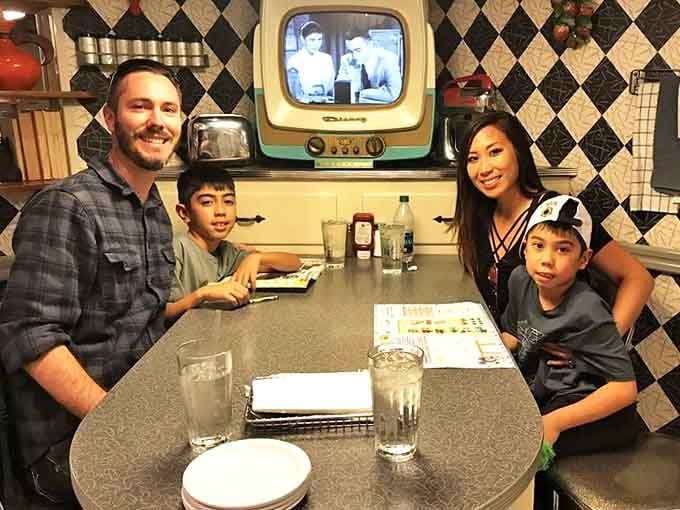 Happy diners gather around formica tables, creating new memories in a setting designed to evoke cherished ones from decades past.