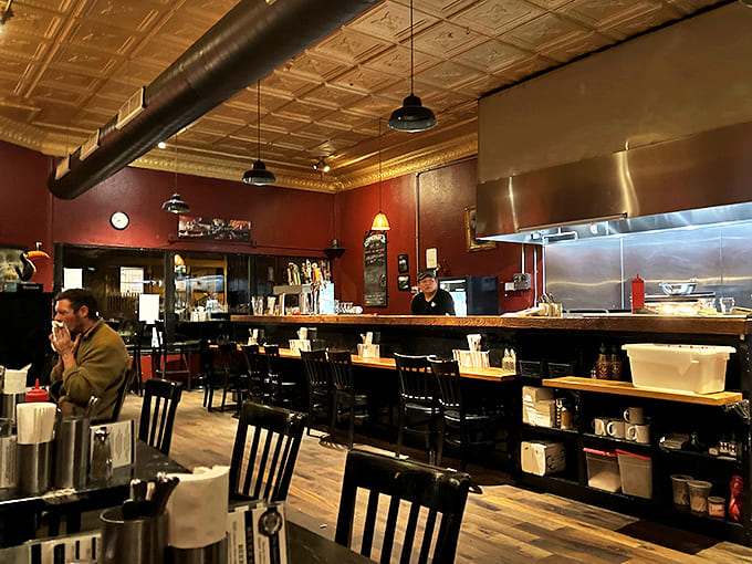 The dining room's warm burgundy walls and wooden accents create the perfect backdrop for the star of the show: the food.