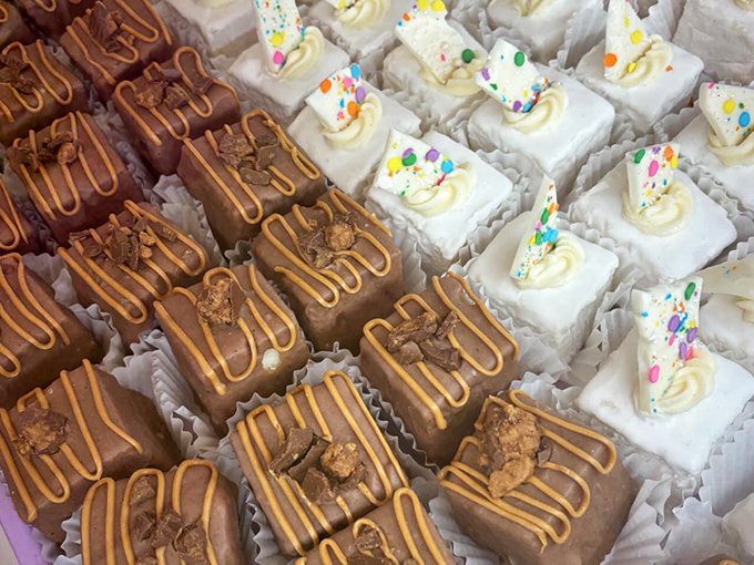 Petits fours arranged with jewel-like precision – two-bite treasures that prove sometimes the smallest indulgences deliver the biggest smiles.