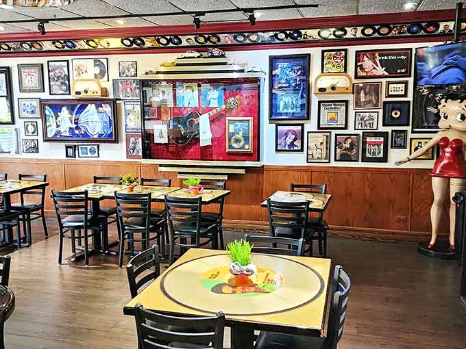 Record-shaped tables and vintage decor create an atmosphere where every seat feels like the best seat in the house.