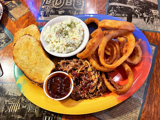 This isn't your average BBQ plate &ndash; tender pulled pork, crispy onion rings, and homemade coleslaw arrive with enough flavor to power a locomotive.
