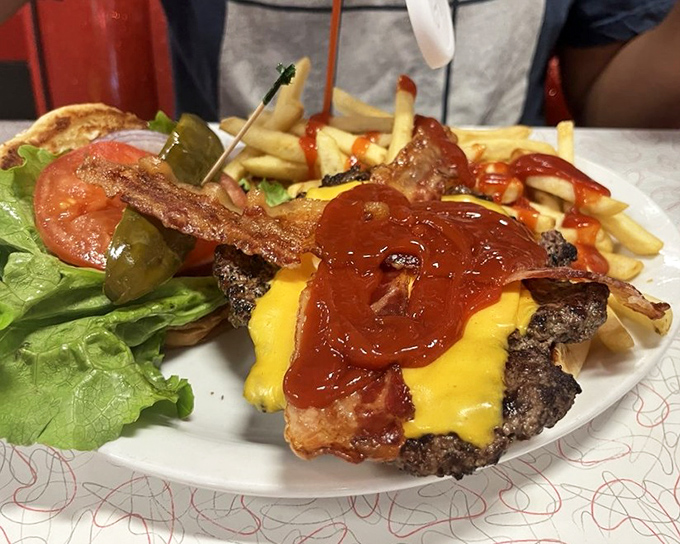 This isn't just a burger &ndash; it's a towering monument to beef, bacon, and cheese that requires a strategy session before eating.
