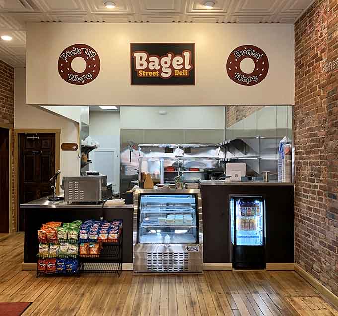 The efficient order counter serves as command central where bagel dreams become delicious reality throughout the day.