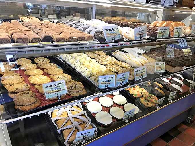 Sweet temptations line the bakery case, from jumbo cookies to traditional Jewish pastries, each promising a perfect end to any meal.