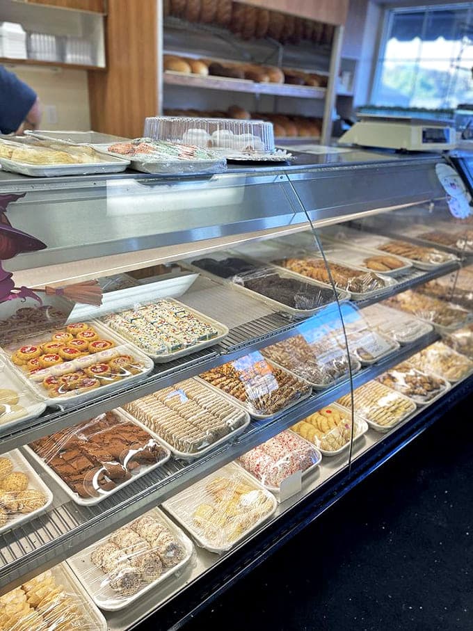 The bakery case displaying enough sweet temptation to make your dentist nervous and your taste buds throw a parade of joy.