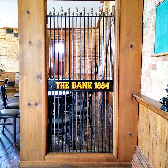 The original bank vault gate stands as a testament to the building's authentic history &ndash; security for gold replaced by culinary treasures.