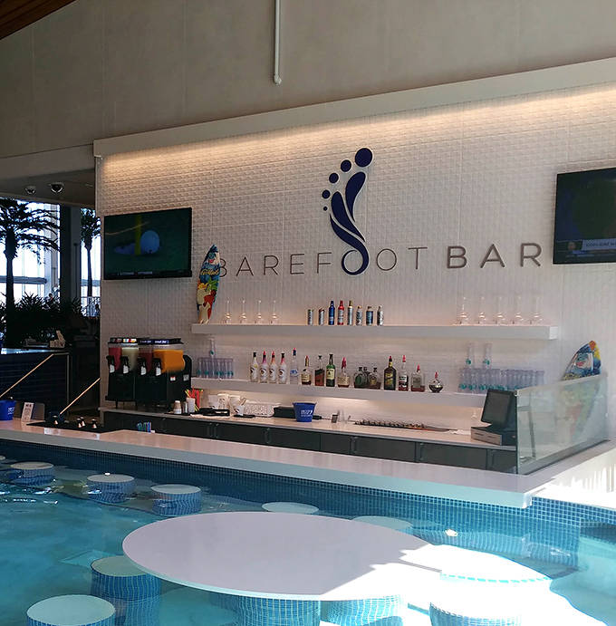 The Barefoot Bar serves refreshments poolside, allowing guests to maintain optimal hydration levels both inside and out.