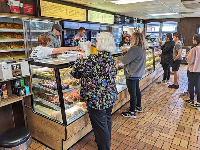 The steady stream of happy customers proves that great donuts never go out of style, unlike your haircut.