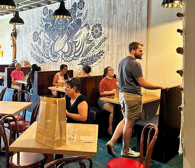 Diners: Patrons savor their hard-won treasures in a dining area where strangers become friends united by buttery bliss.