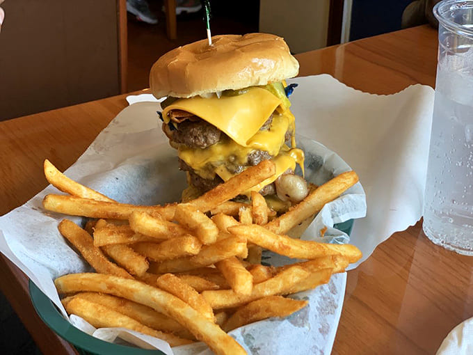 A skyscraper of beef and cheese that challenges gravity and appetite alike &ndash; conquering this masterpiece earns serious bragging rights.
