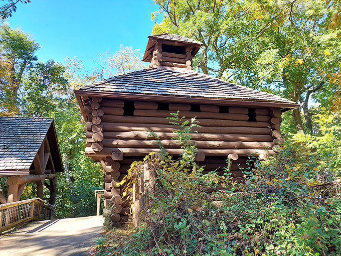 This rustic log structure seems transported from pioneer days, offering a glimpse into Illinois' rich history amid natural splendor.