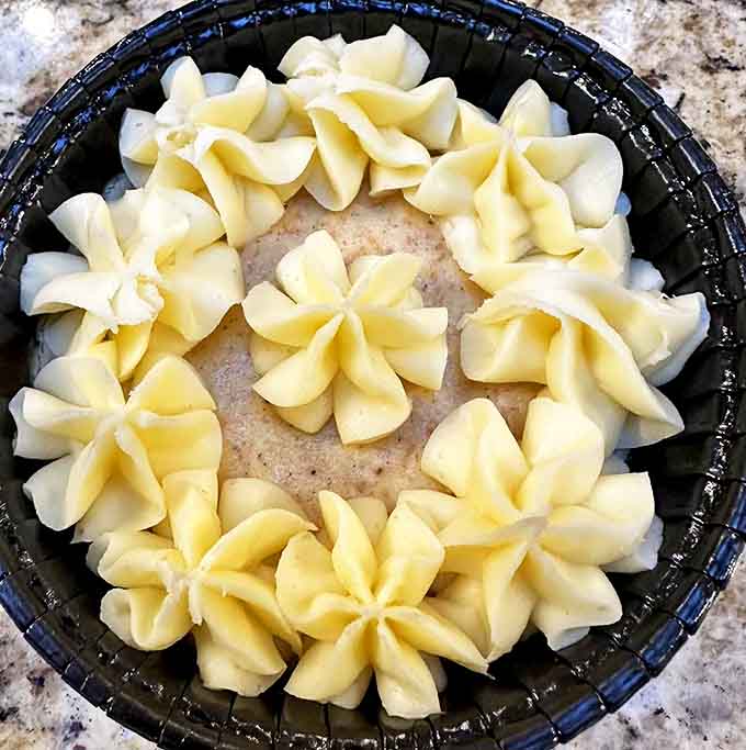 This isn't just carrot cake&mdash;it's a masterpiece of piped cream flowers that almost makes you feel guilty about destroying such beauty. Almost.