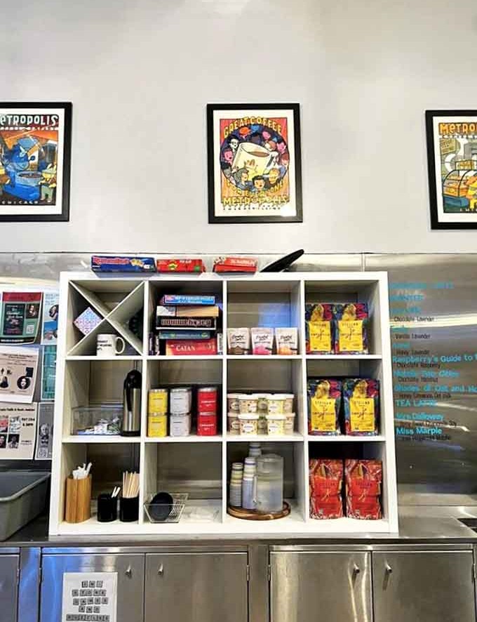 Board games and coffee supplies share shelf space, reminding visitors that Volumes celebrates both solitary reading and communal connection.