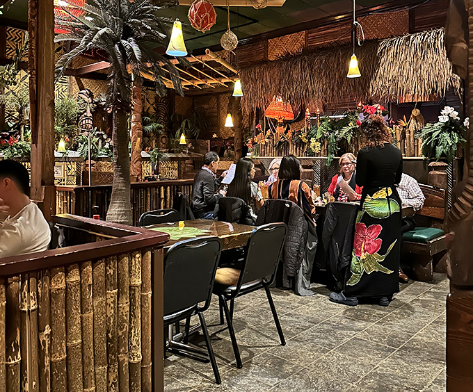 Diners enjoy their island escape, surrounded by authentic Polynesian d&eacute;cor that transforms an ordinary evening into an extraordinary adventure.