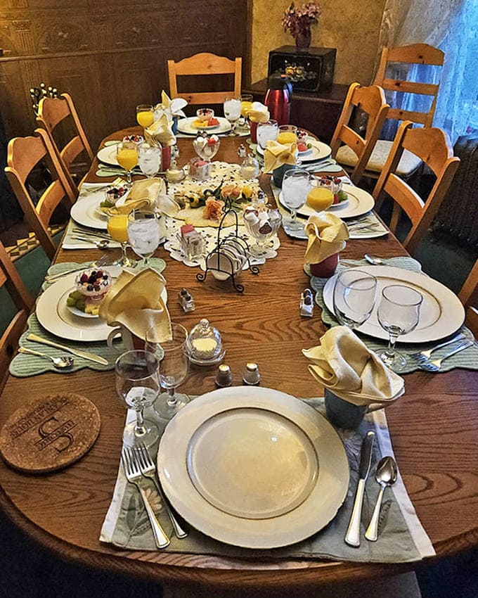 The breakfast table, set and waiting for morning, promises the kind of meal that makes people voluntarily wake up early on vacation.