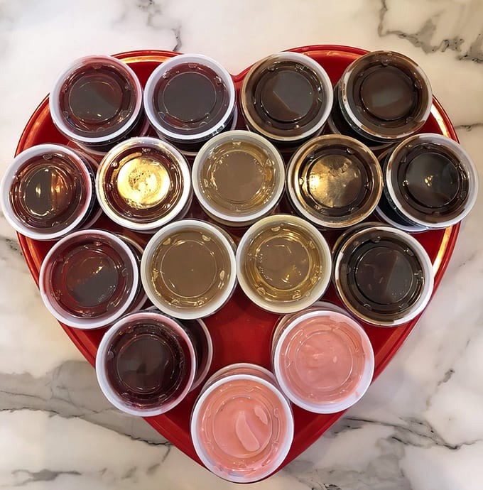 A rainbow of dipping sauces arranged like edible art, ready to complement everything from gator bites to whatever else you're brave enough to dunk.