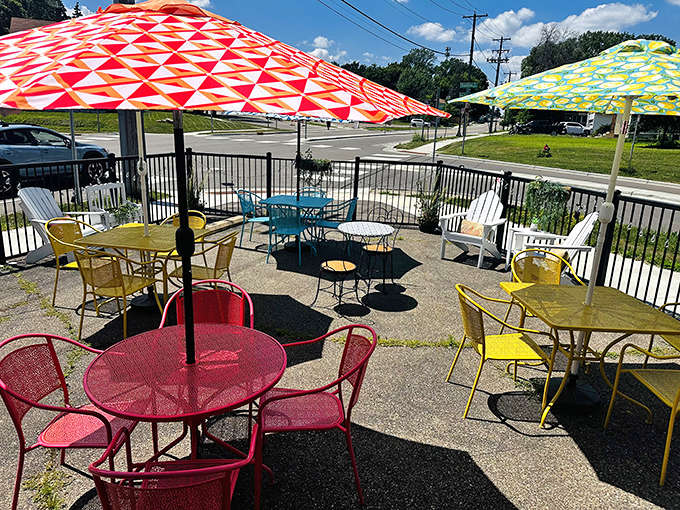A rainbow of metal furniture creates an instant mood lift, even before your taste buds join the party.